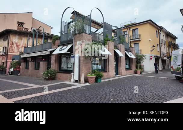 Bardolino, Italy - May 14, 2026 - Charming European street scene with ...