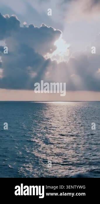 Sunlight breaks through clouds in the open sea. Recorded from a crusie ...