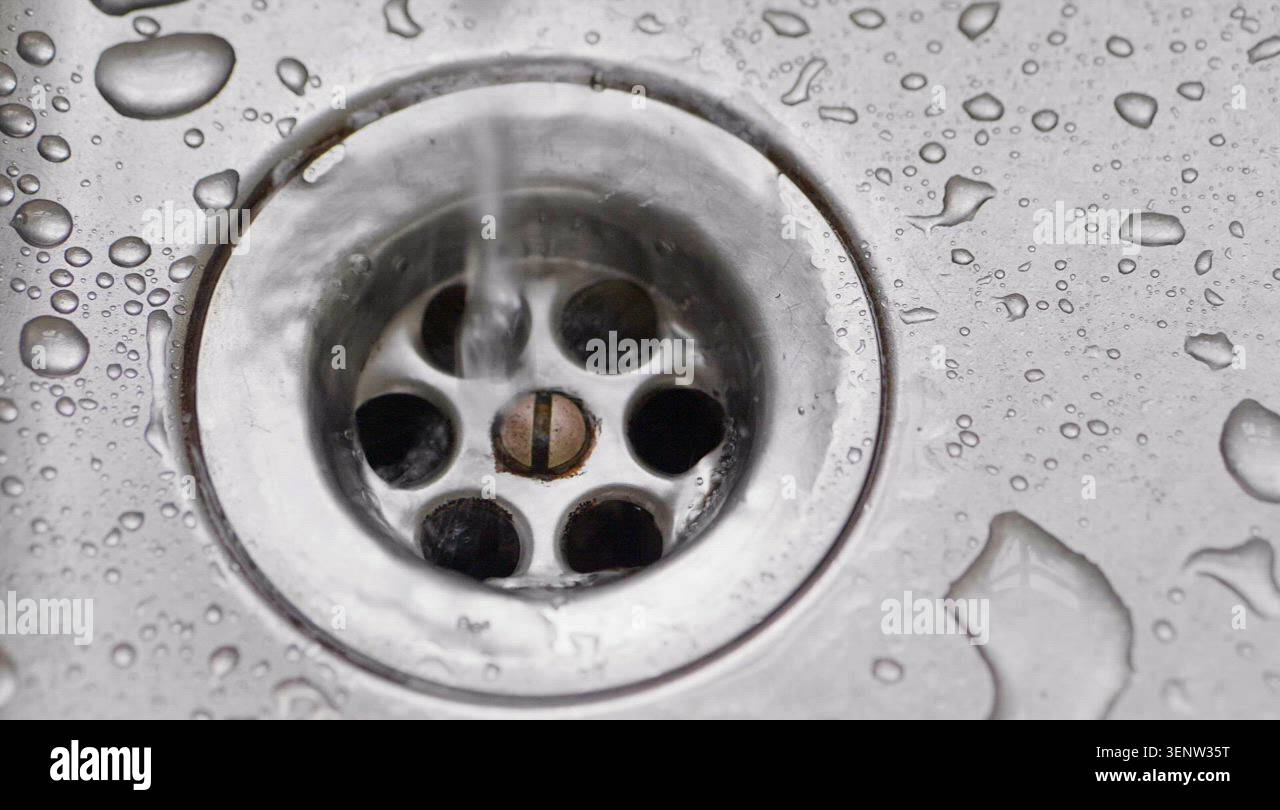 Dripping water going down the drain Stock Video Footage - Alamy
