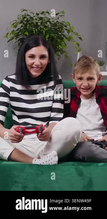 Close up of good-natured cheerfyl carefree excited brunette and 8-aged ...