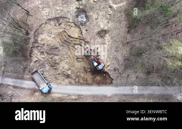 Earthworks happening in a rural forested area Stock Video Footage - Alamy