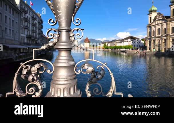 Idyllic summer view of the Reuss river in Lucerne with the famous ...