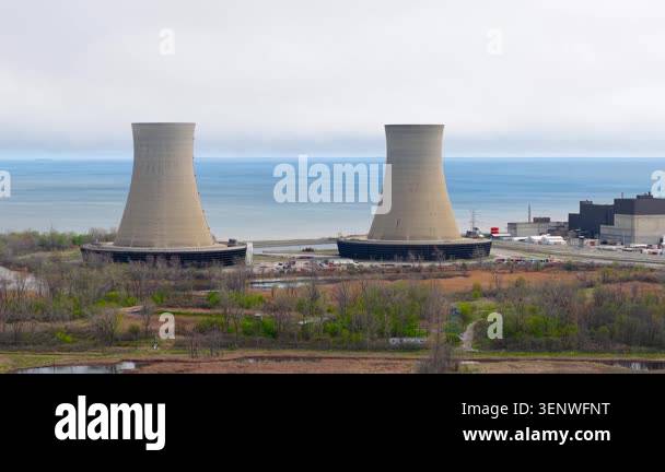 Two large concrete cooling towers of a nuclear power plant on a ...
