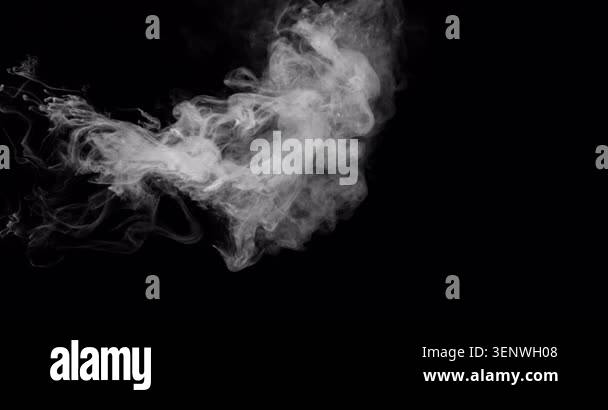 Slow motion white smoke cloud drifting across black background ...