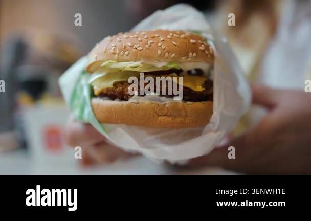 Detailed macro shot of a delicious fresh cheeseburger with meat patty ...
