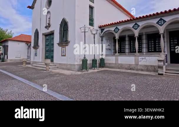 Traditional Portuguese church architecture featuring a stone paved ...