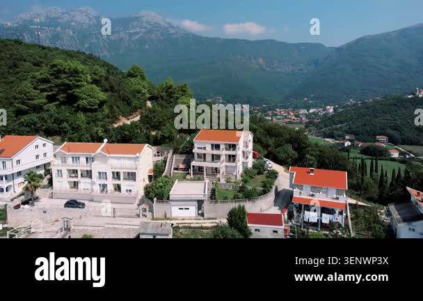 Aerial mountain valley view over rooftops and hillside villas near ...