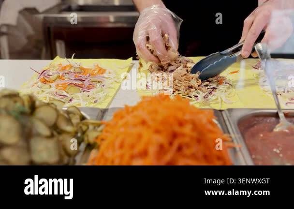 Cooking process of tasty shawarma or durum doner kebab, chef making ...