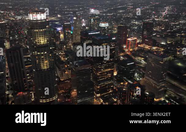 Nighttime panorama revealing downtown Los Angeles skyline, urban sprawl ...