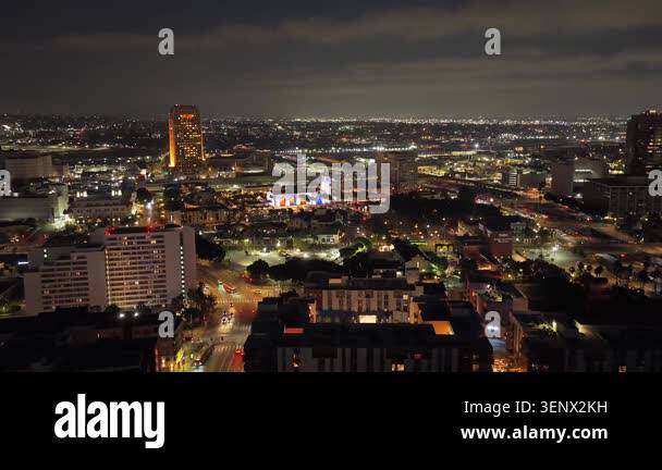 Cinematic aerial panorama of Union Station District at night showing ...