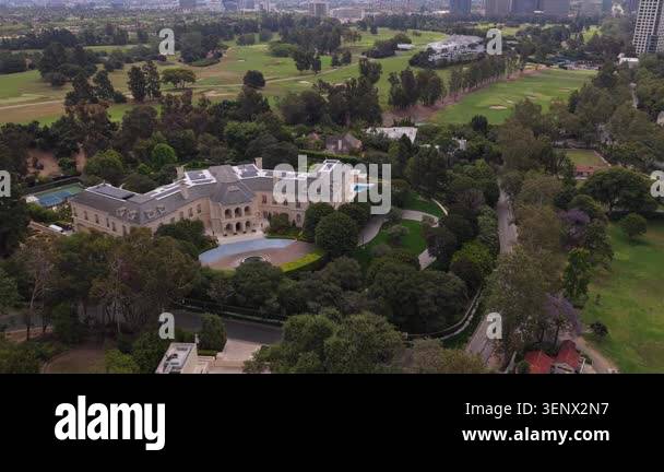 Aerial revealing mansions and Los Angeles Country Club golf course ...