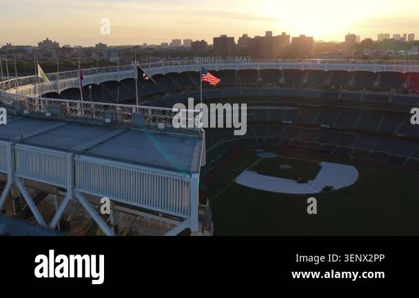 Yankee Stadium in South Bronx, New York at sunset with american flag ...