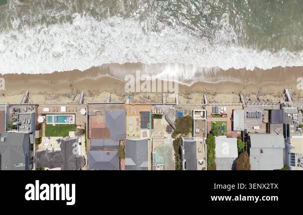 Top down tripod scenery shows luxury Malibu beachfront real estate with ...