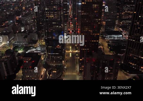 Nighttime aerial journey through downtown Los Angeles canyon streets ...