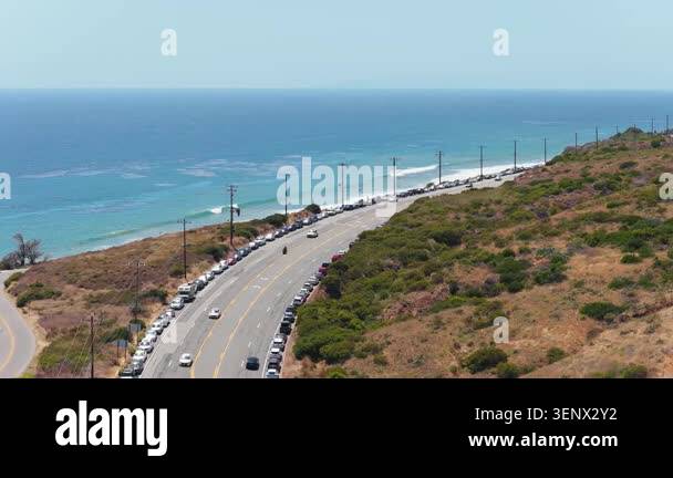 Scenic aerial of Pacific Coast Highway in Malibu with cars driving ...