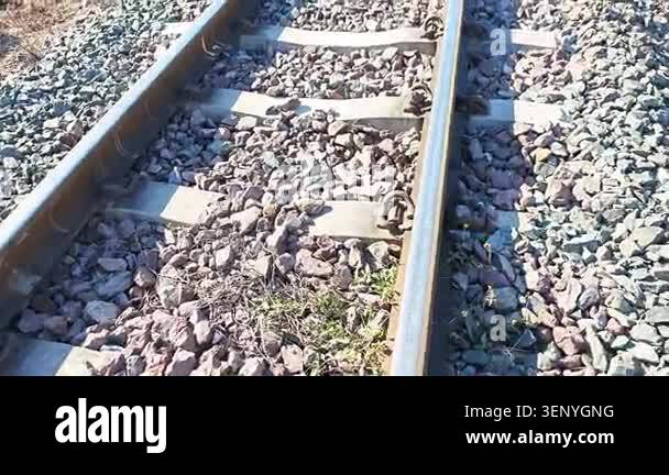 Close-up of railway track steel rails and concrete sleepers with ...