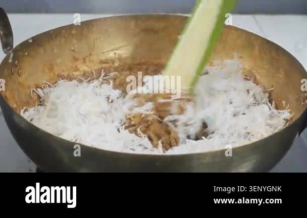 Fresh shredded coconut topped on traditional Thai dessert "Khanom Pad ...