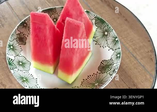 Fresh red watermelon slices served on a ceramic plate Stock Video ...