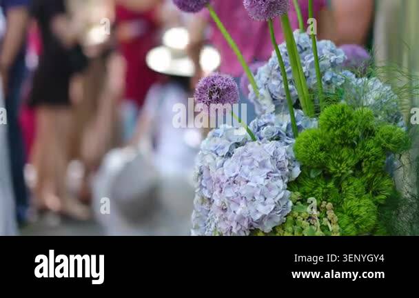 Beautiful flower bouquet with purple allium and blue hydrangeas. In the ...