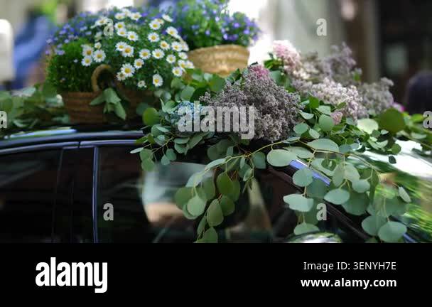 Elegant wedding car featuring a beautiful decoration of flowers and ...
