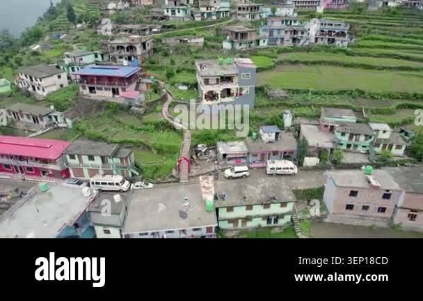 An aerial view of a village nestled in the Garhwal Himalayas ...