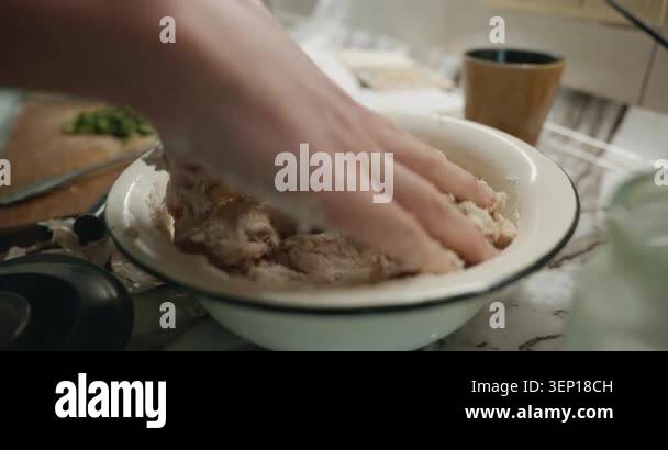 Caucasian man knead dough for baking pie. Single male is cooking at ...