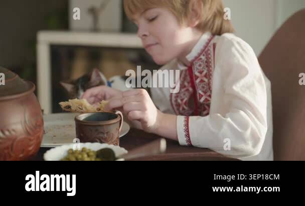 Man With Kid Boy Eat Food Lunch Dinner. Family in Ukrainian Traditional ...
