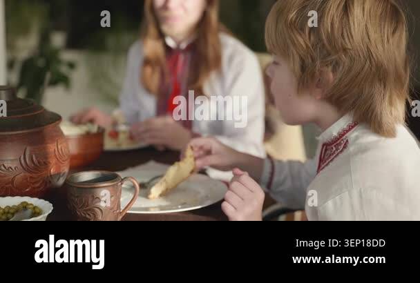 Man With Kid Boy Eat Food Lunch Dinner. Family in Ukrainian Traditional ...