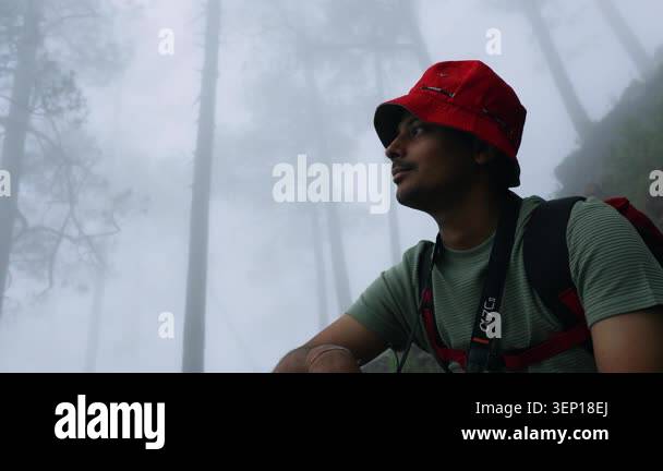 A lone trekker pauses to admire the breathtaking Chaukhamba massif ...