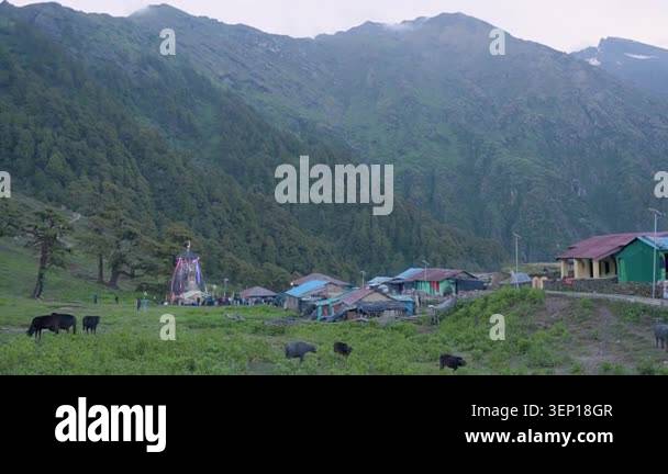 A scenic view of Madmaheshwar village with traditional houses and a ...