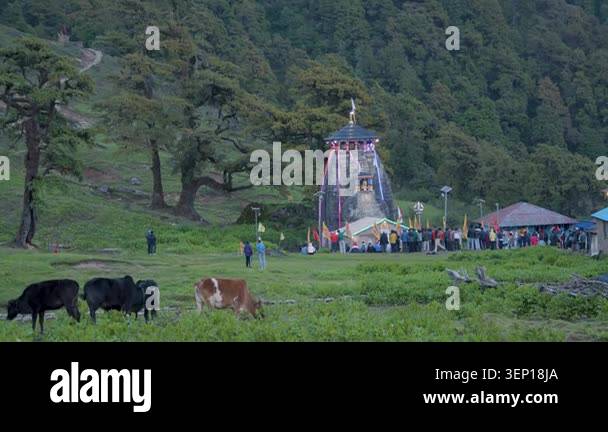 A sacred Hindu temple complex nestled in the Himalayas, surrounded by ...