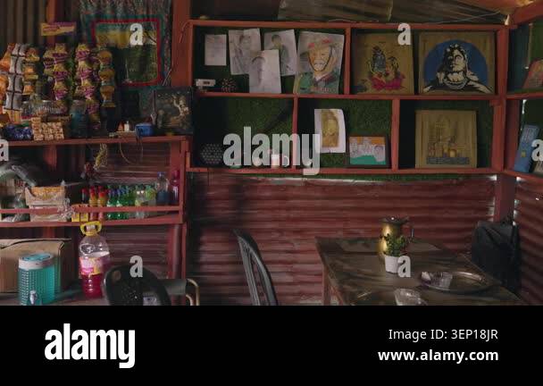 Warmly lit wooden cabin displaying trekking memorabilia, maps, and ...
