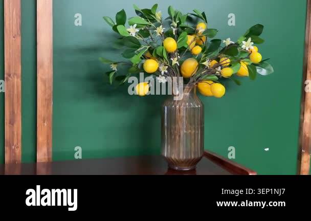 Stylish room interior with piano and elegant vase filled with ...