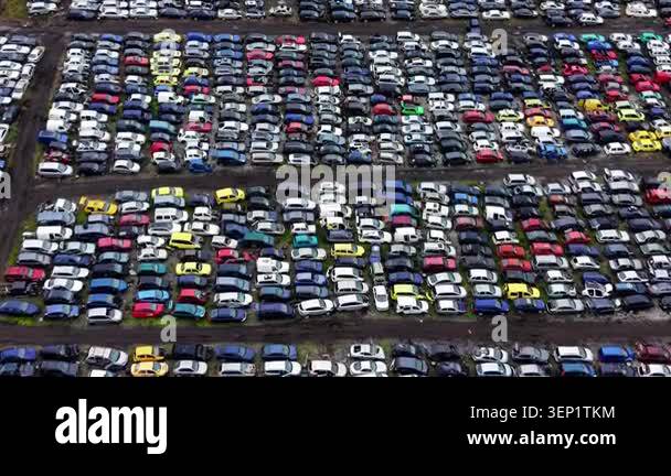 Overhead drone shot of densely packed junkyard cars, Bulgaria. Flat top ...