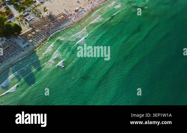 Aerial View of a long sandy coastline with turquoise water and green ...