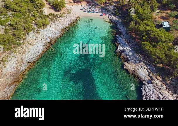 Aerial view of the tiny Agia Anna Beach with turquoise water, rocky ...