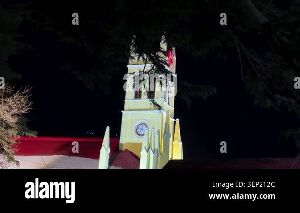 majestic christian church tower at night with illuminated facade and ...