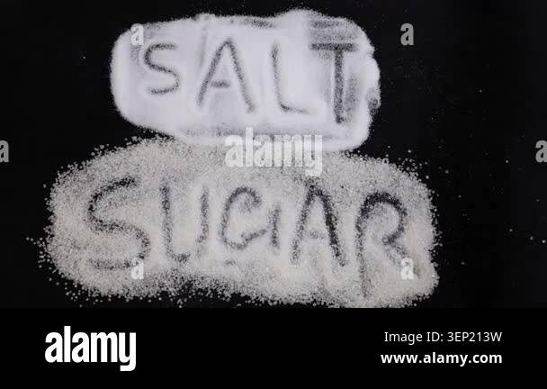 salt versus sugar concept with crystal lettering and nutrition ...