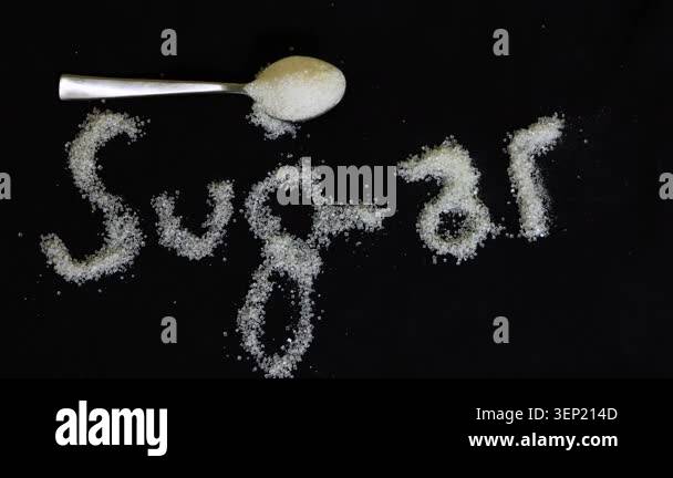 white sugar grains forming sugar word symbolizing sweetness and ...