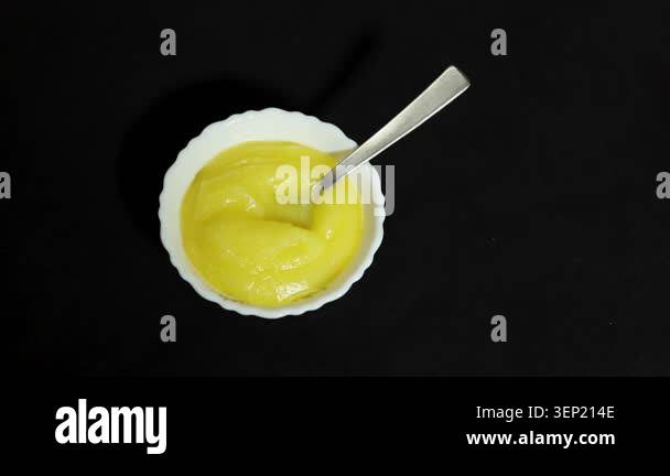 pure desi ghee served in spoon showcasing traditional dairy ingredient ...