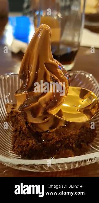 Eating Chocolate Soft-Serve Ice Cream Atop a Warm Brownie Drizzled with ...
