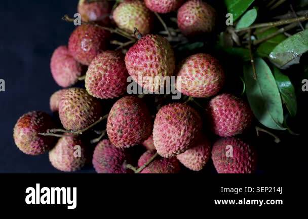 juicy ripe lychees with natural texture and vibrant colors with leafy ...