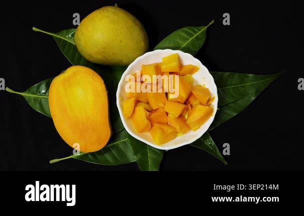ripe mango fruit and diced mango chunks showcasing healthy tropical ...
