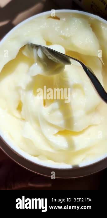 Close-up macro view of thick cream hair mask texture being swatched and ...