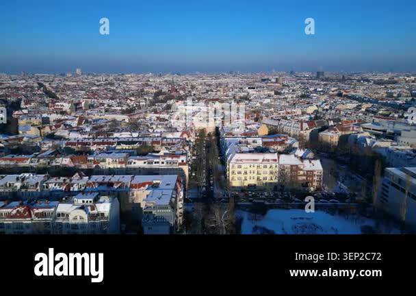 Berlin cityscape with buildings and streets covered in fresh snow on a ...