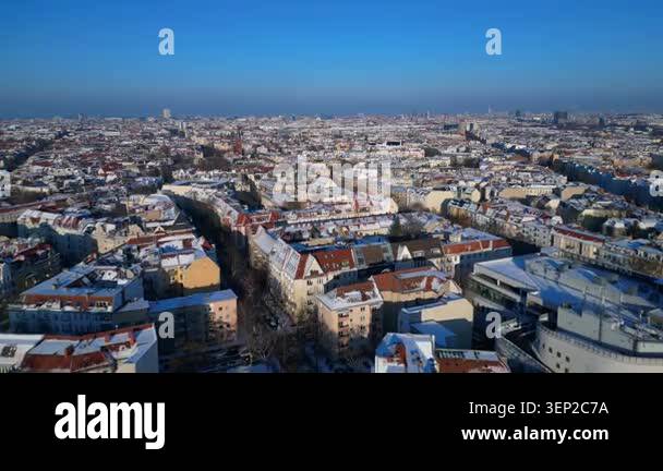 Berlin cityscape with buildings and streets covered in fresh snow on a ...
