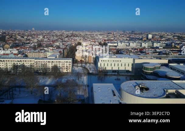 Berlin cityscape with buildings and streets covered in fresh snow on a ...