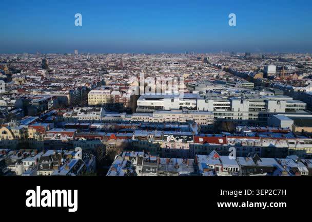 Berlin cityscape with buildings and streets covered in fresh snow on a ...