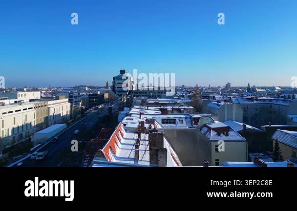 Berlin cityscape with snow covered buildings and a busy street, showing ...