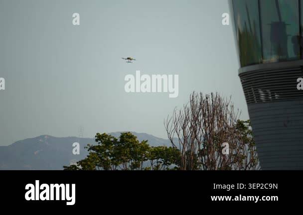 Modern autonomous quadcopter drone deliver packages in modern City ...